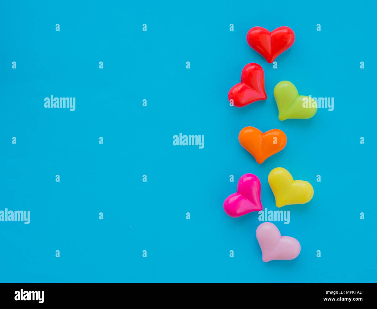 colorful heart on blue background Stock Photo - Alamy
