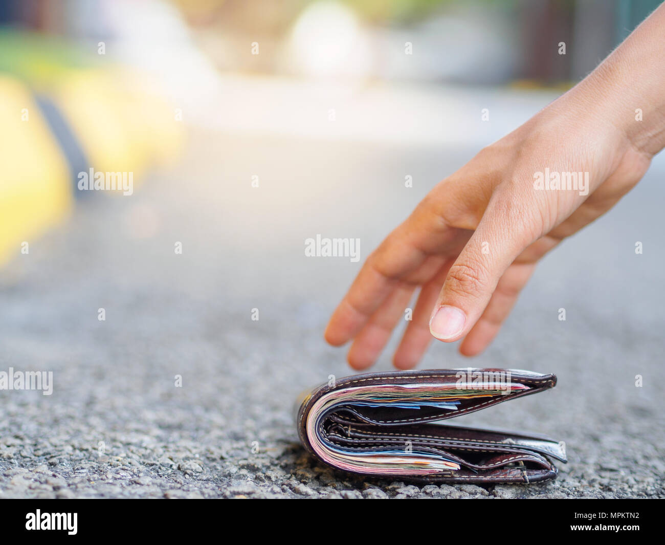 Hand wallet road hi-res stock photography and images - Alamy