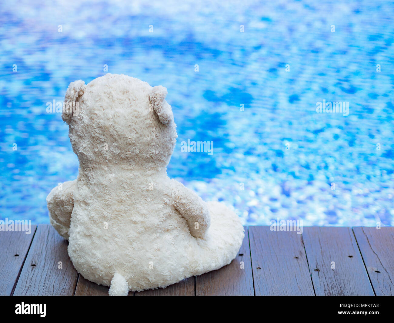 Child teddy bear water hi-res stock photography and images - Alamy