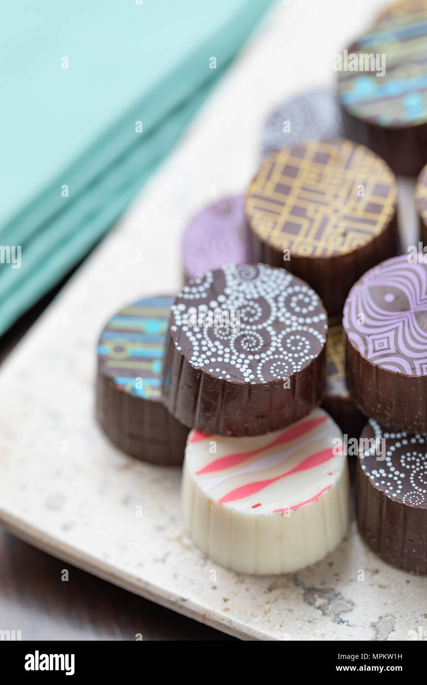 Artisan Fine Chocolate Candy On Serving Dish Stock Photo - Alamy