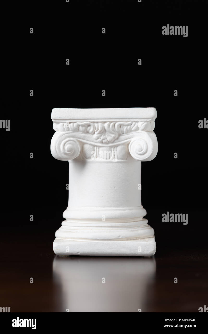 White Ionic Design Column on Dark Background Stock Photo - Alamy
