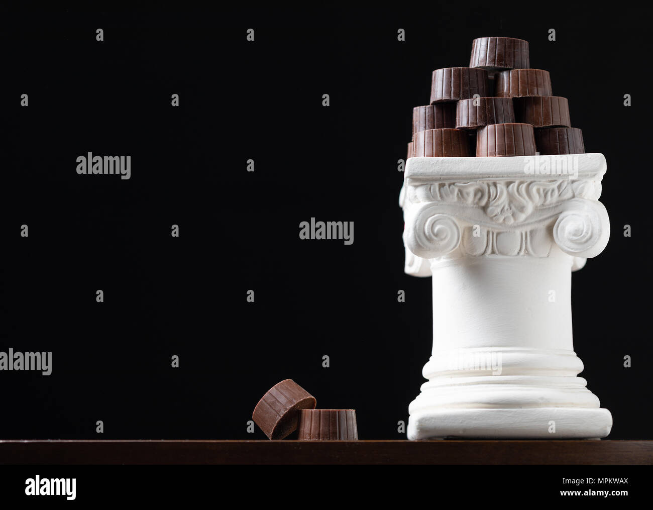 Stack of Fine Artisan Chocolates Stacked On White Pillar Column Stock ...