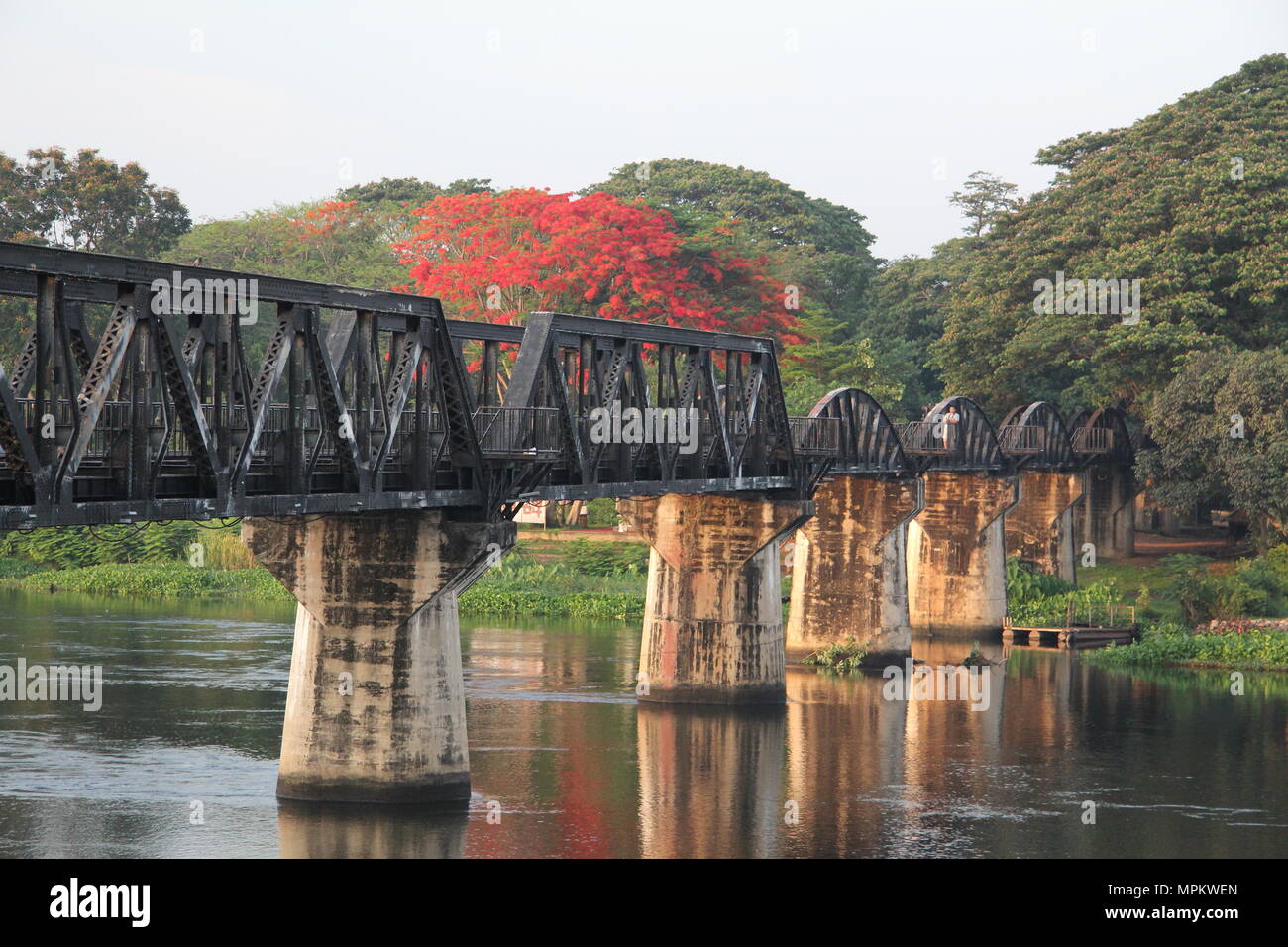 Train bridge over the river with beautiful colored treed in the ...