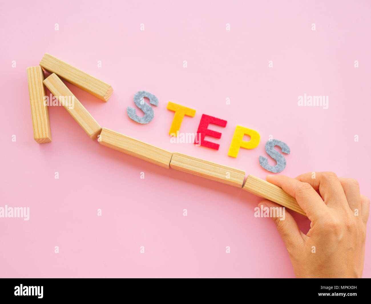 Concept of building success foundation. Women hand put wooden blocks in ...