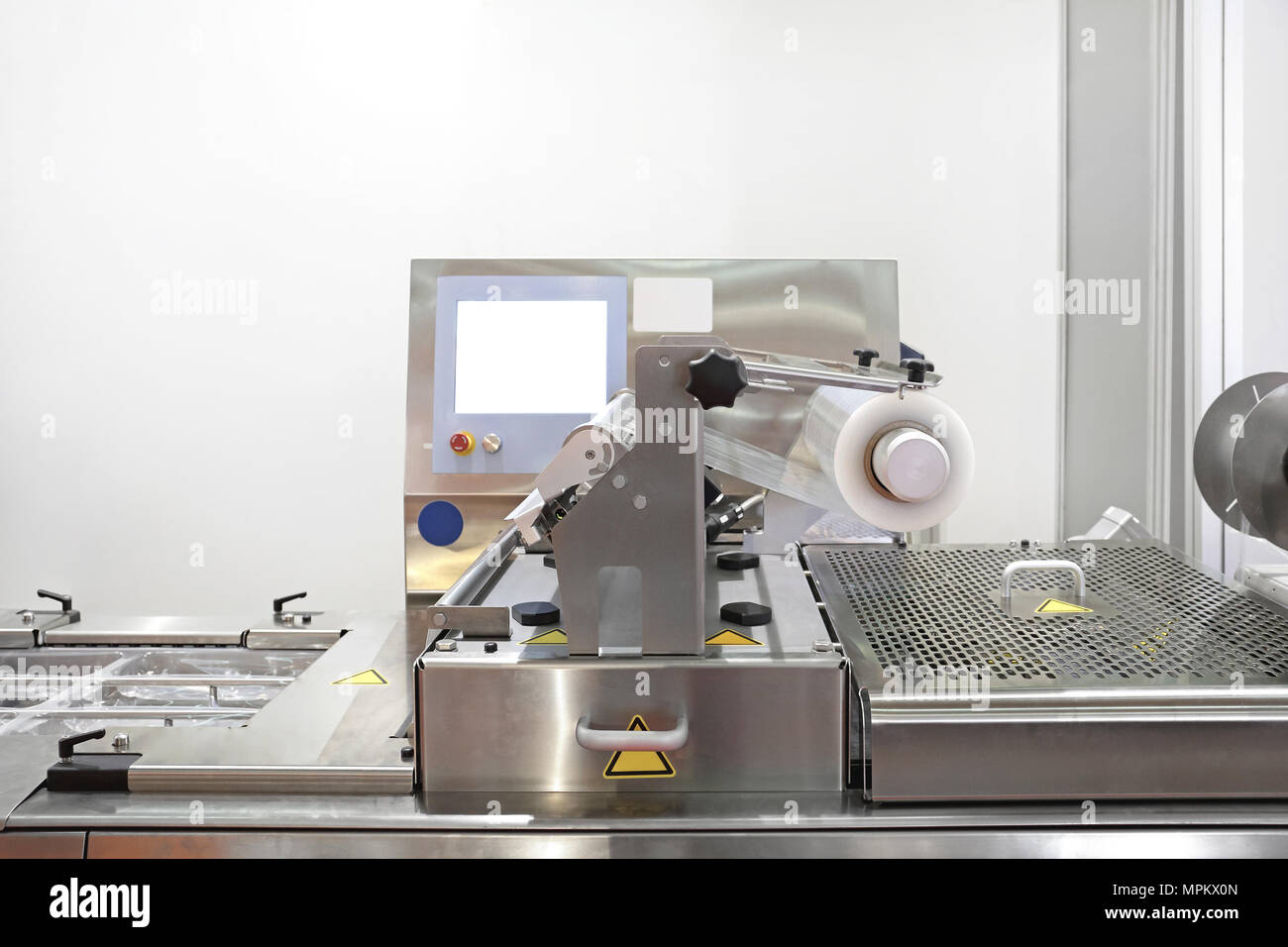 Automated Foil Packaging Machine in Food Factory Stock Photo - Alamy