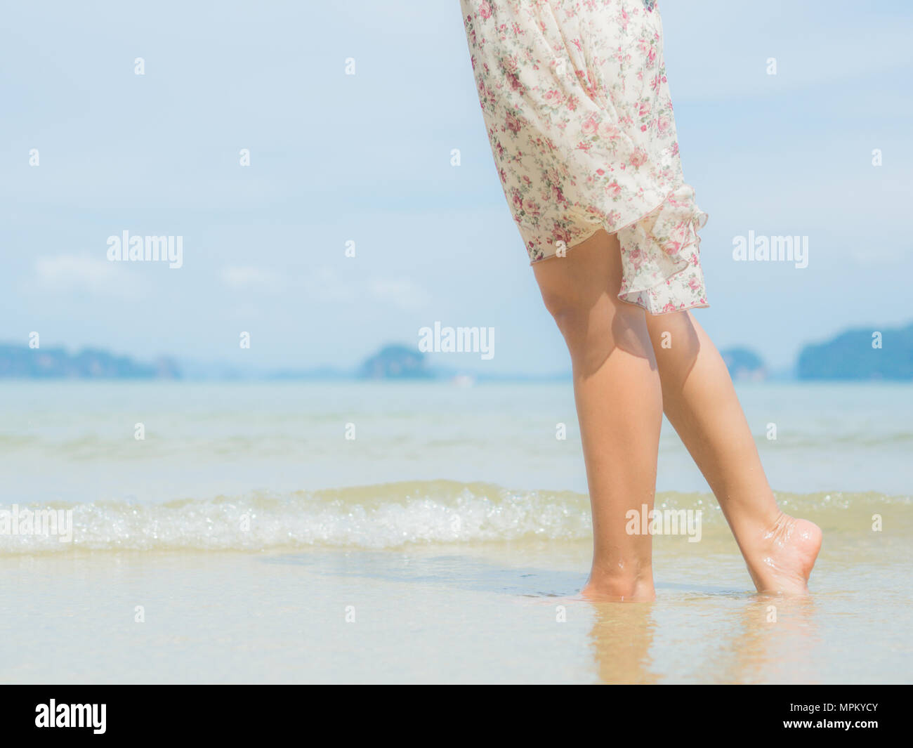 Beach travel - woman walking on sand beach. Closeup detail of female ...