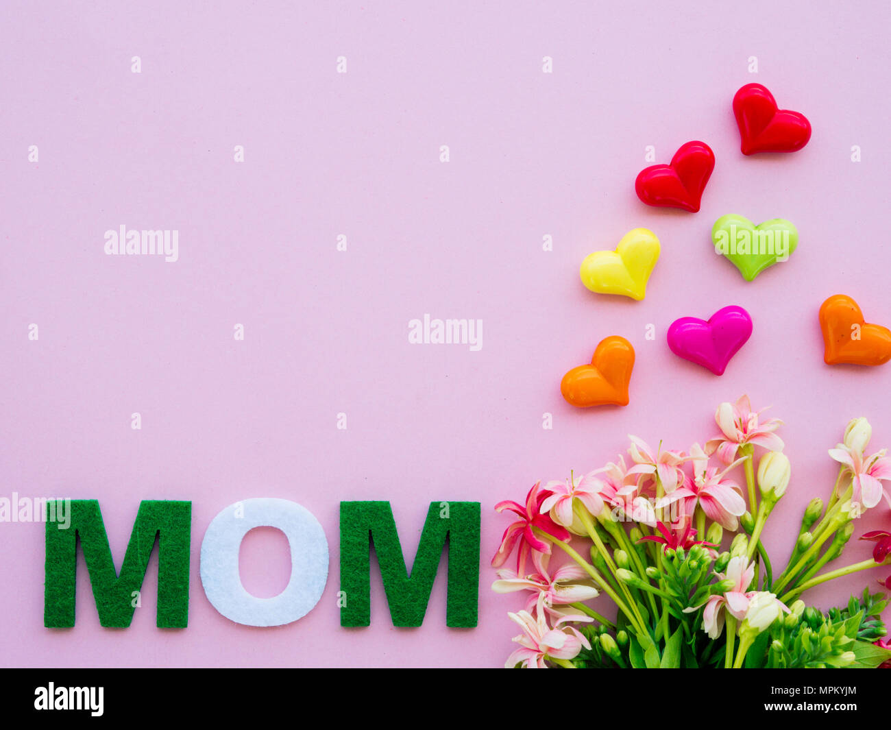 mother's day concept. MOM alphabet with colorful of heart and flower on ...