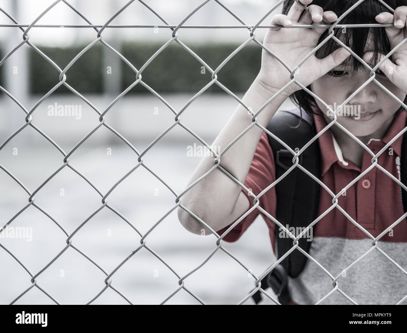 Boy Behind Wire Fence High Resolution Stock Photography and Images - Alamy