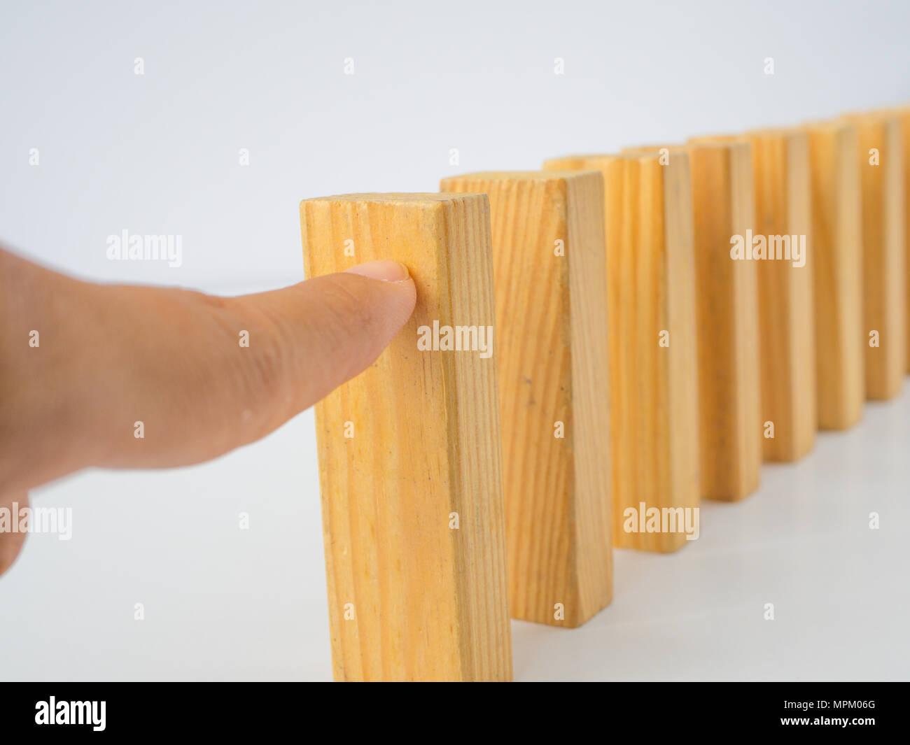 Finger pushing dominoes hi-res stock photography and images - Alamy