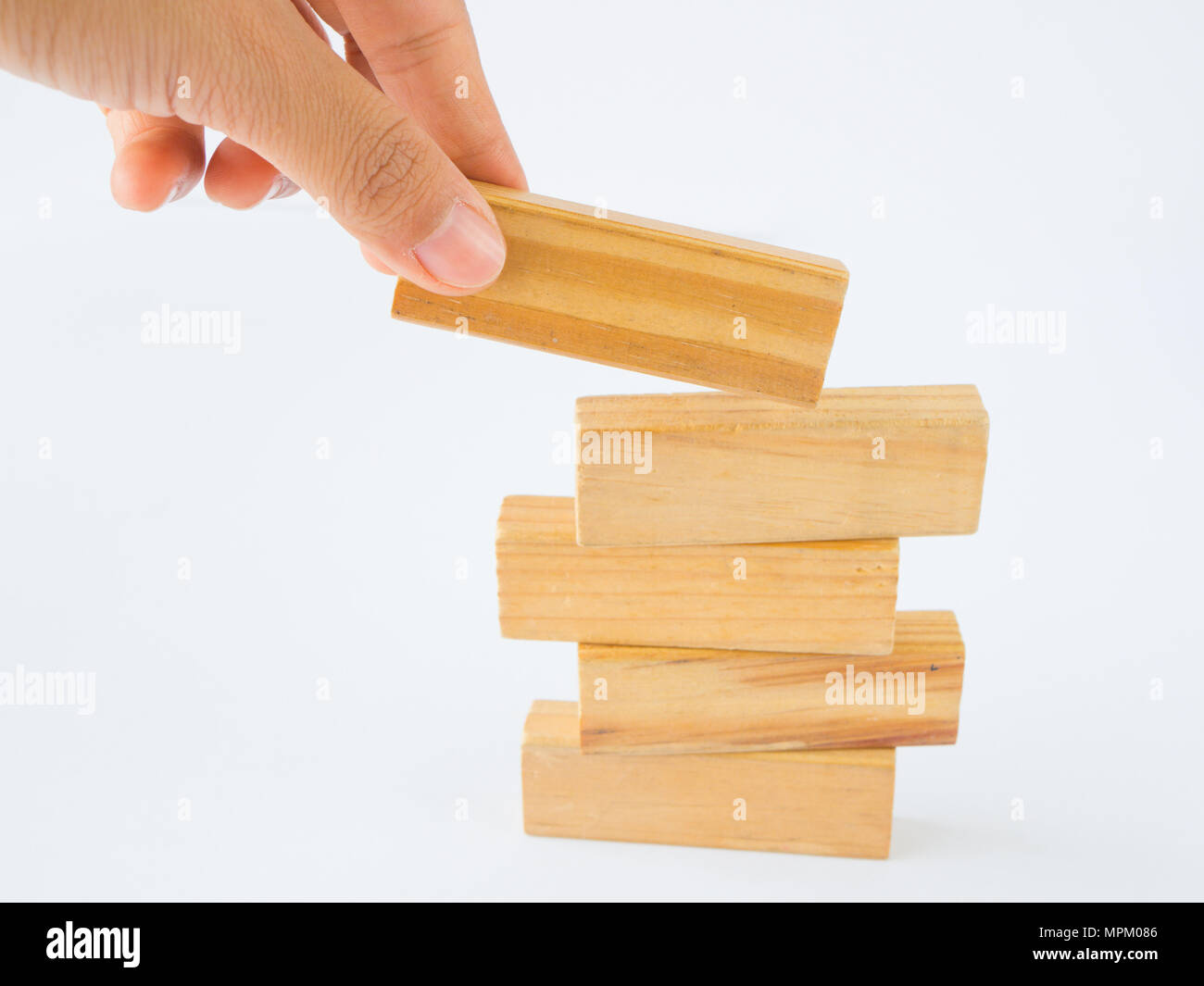 Concept of building success foundation. Women hand put wooden blocks on ...