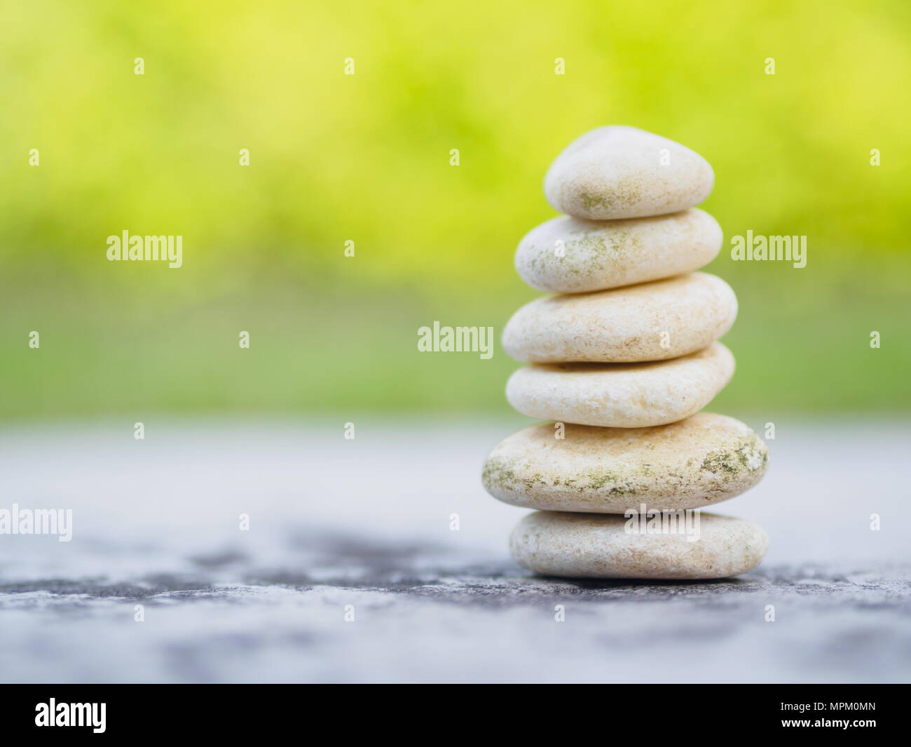 Balance Stones stacked to pyramid in the soft green background to Spa ...
