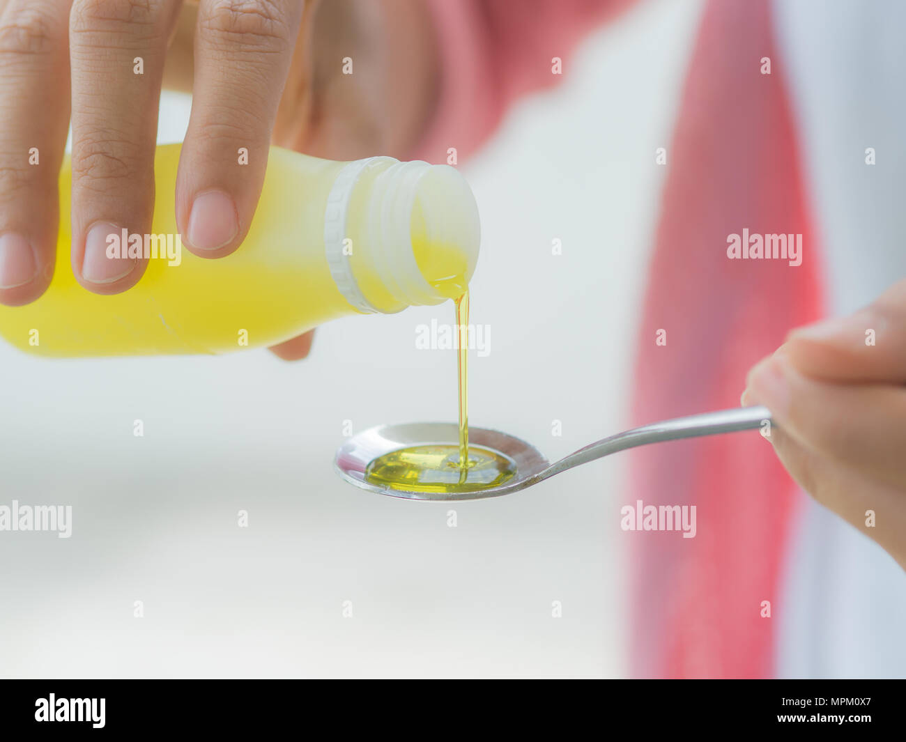 Cough syrup measuring spoon hi-res stock photography and images - Alamy