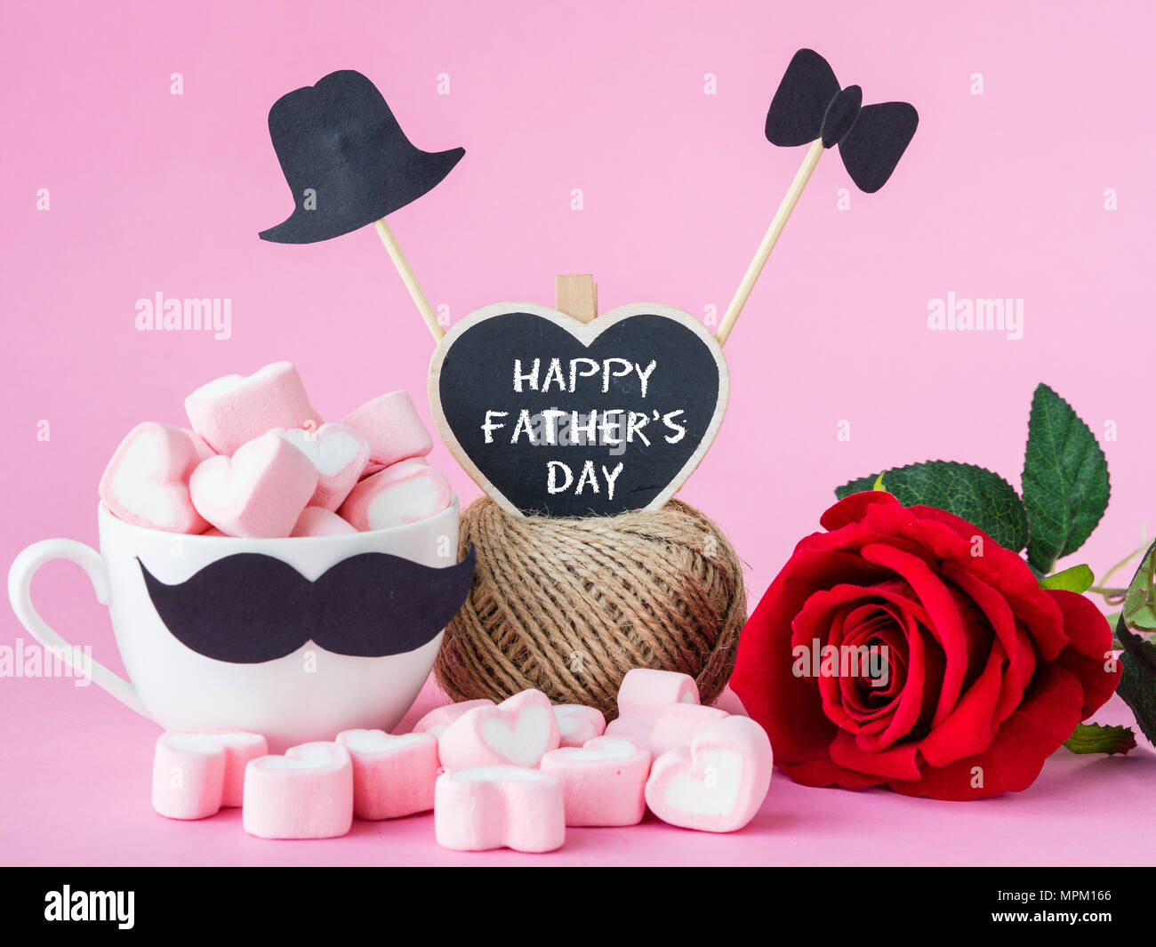 Father's day concept. Happy Father's Day message with red rose on pink ...