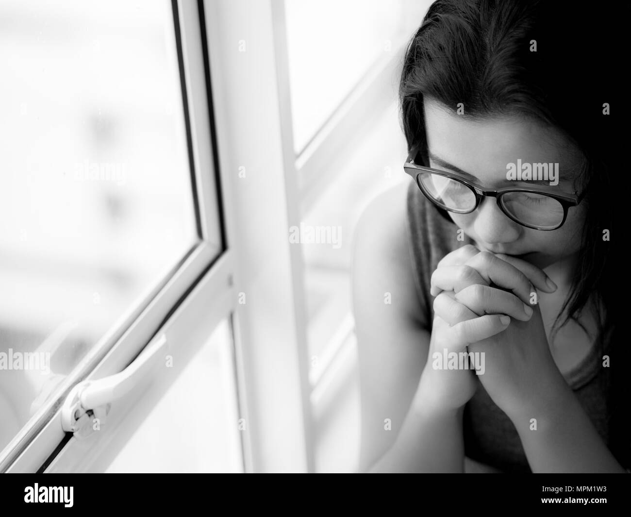 Black and white people praying together hi-res stock photography and ...