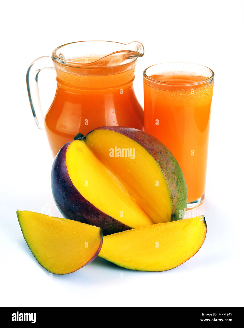 mango juice with mango slice isolated on white background. jug of mango ...