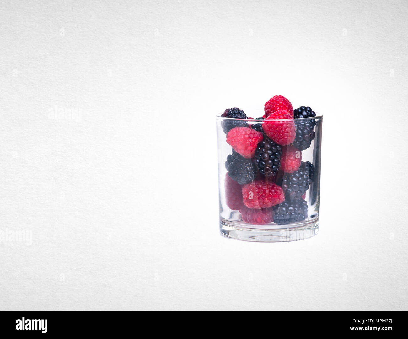 raspberry and blackberry on white isolated background Stock Photo - Alamy