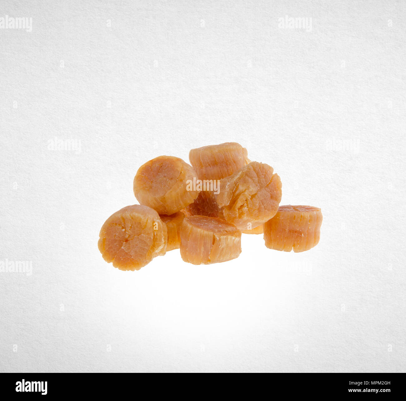 scallop or dried scallop on a background Stock Photo - Alamy