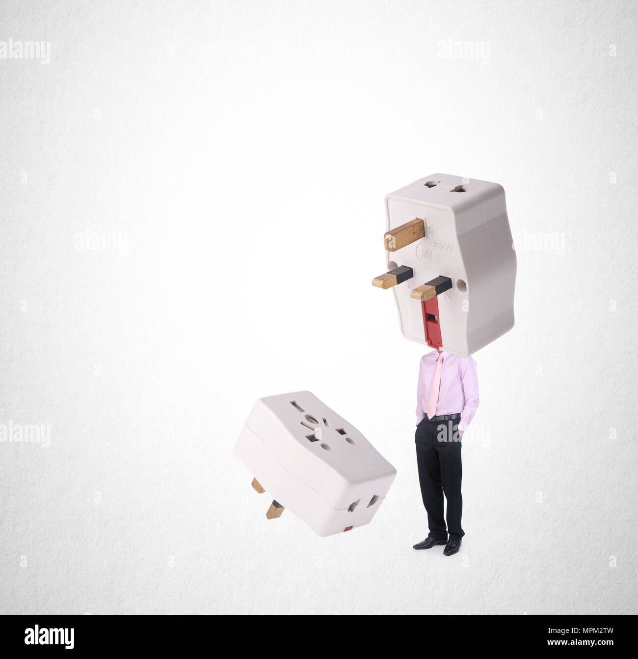 man or plug headed man with concept on background Stock Photo - Alamy