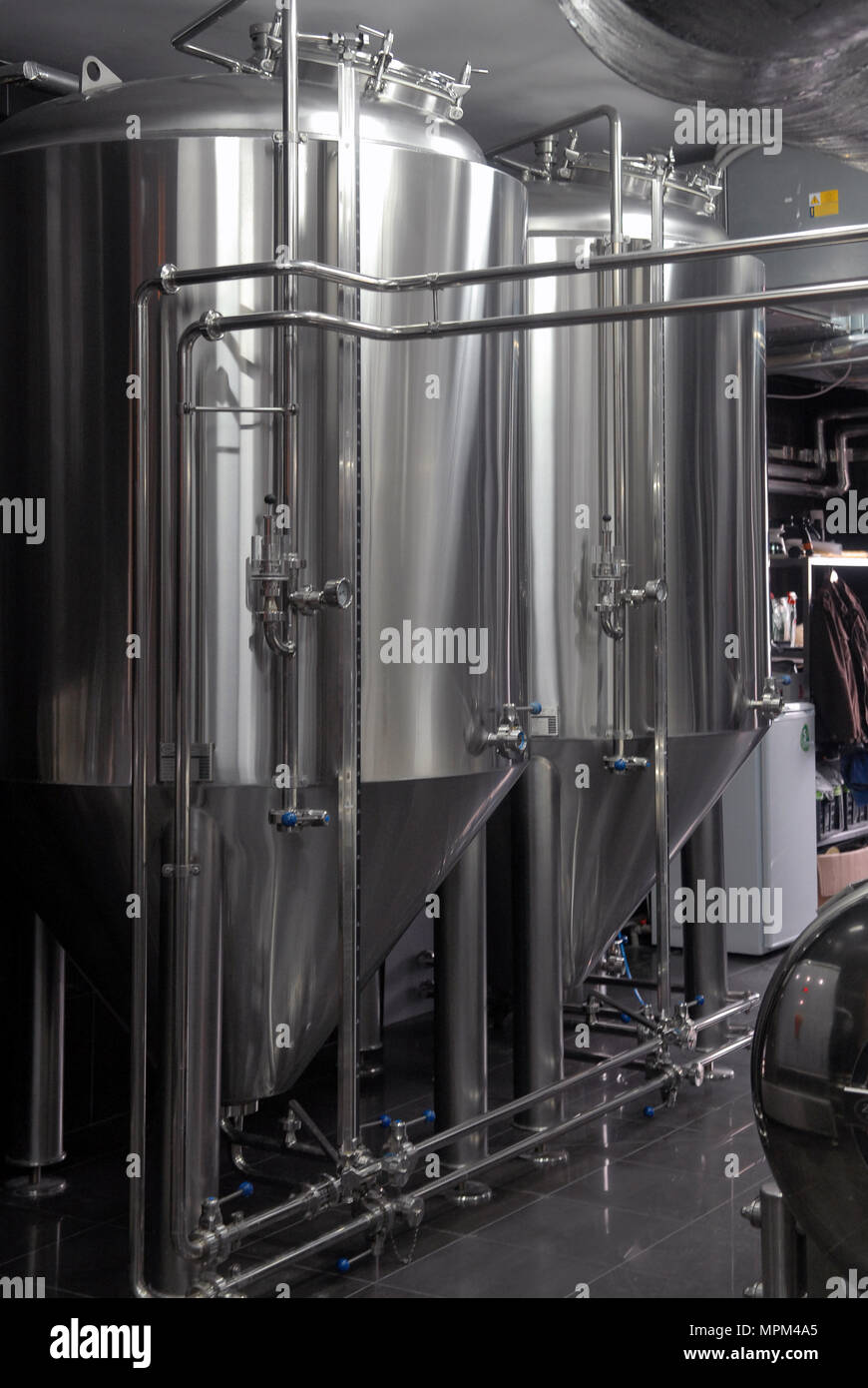 Row of tanks in microbrewery Stock Photo - Alamy