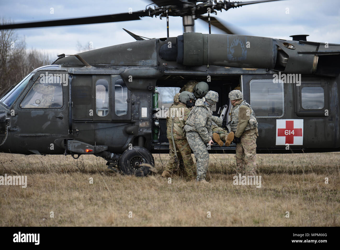 U.S. Soldiers, assigned to Public Health Command Europe, load a ...