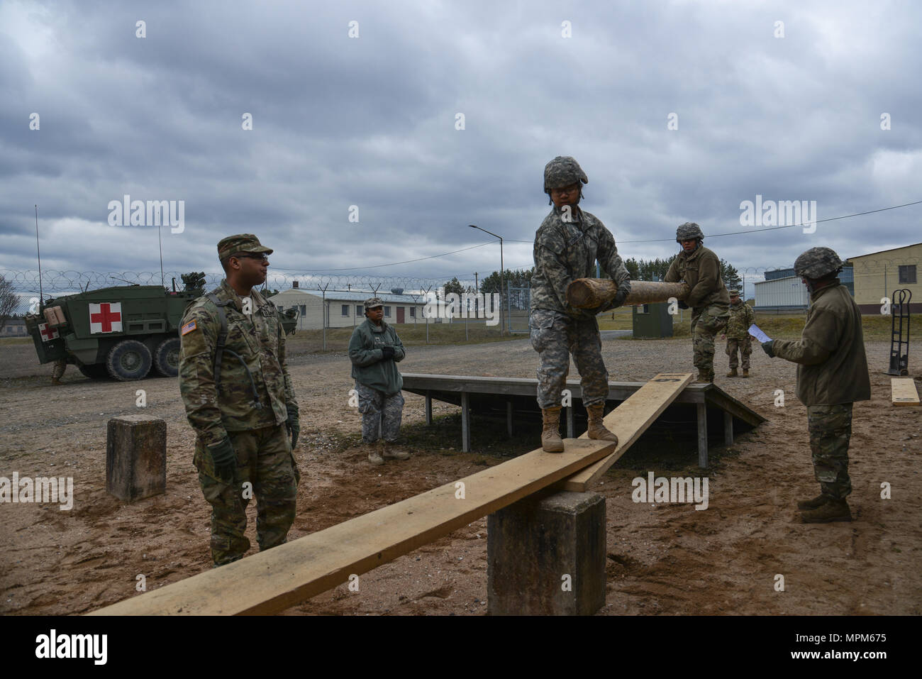 U.S. Soldiers, assigned to Public Health Command Europe, work together ...