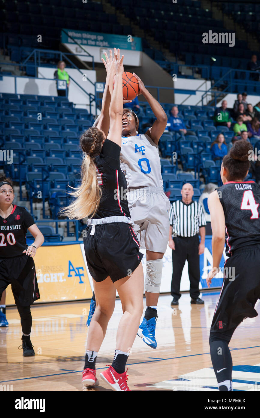 Falcons guard Dee Bennett, a junior, shoots over an Aztec defender as ...