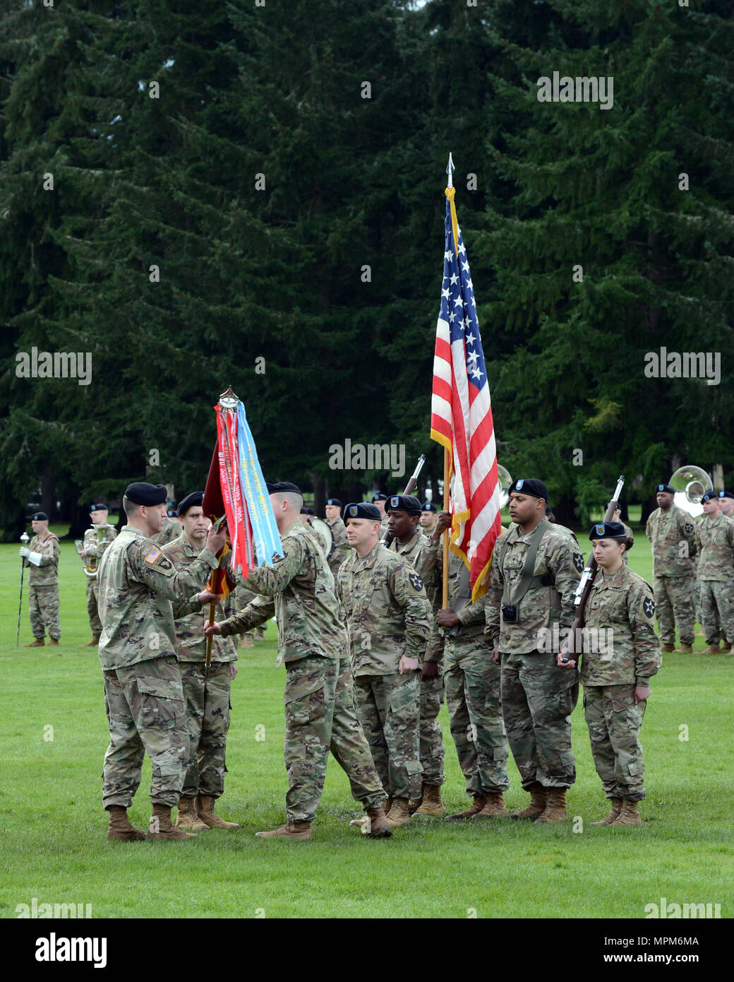 LTC Justin M. Zimmer, outgoing commander, steps forward to hand the ...
