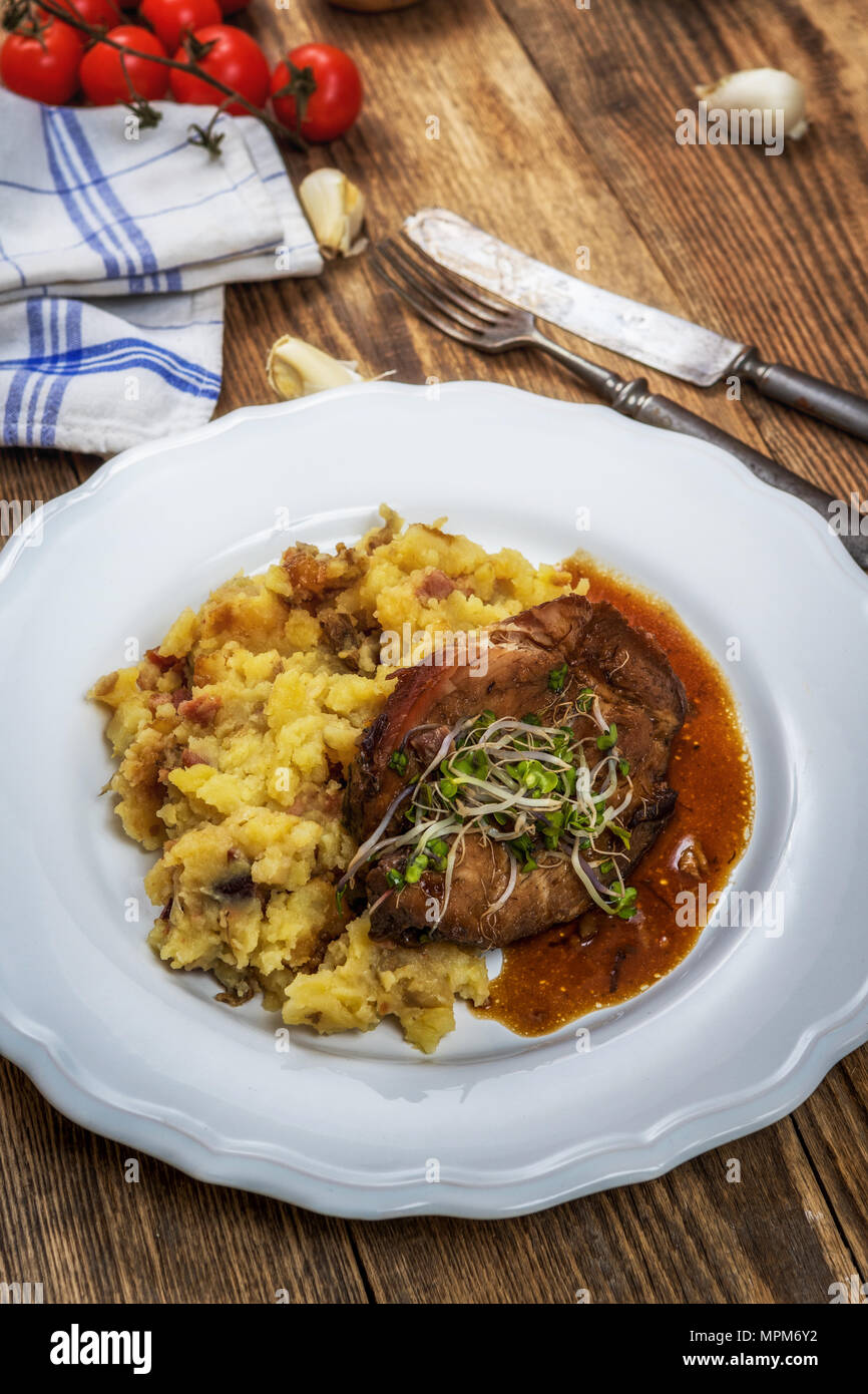 Grilled pork neck with mashed potatoes and bacon Stock Photo - Alamy