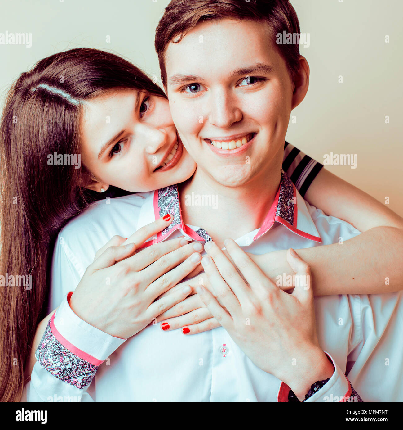 couple of happy smiling teenagers students, warm colors having a Stock ...
