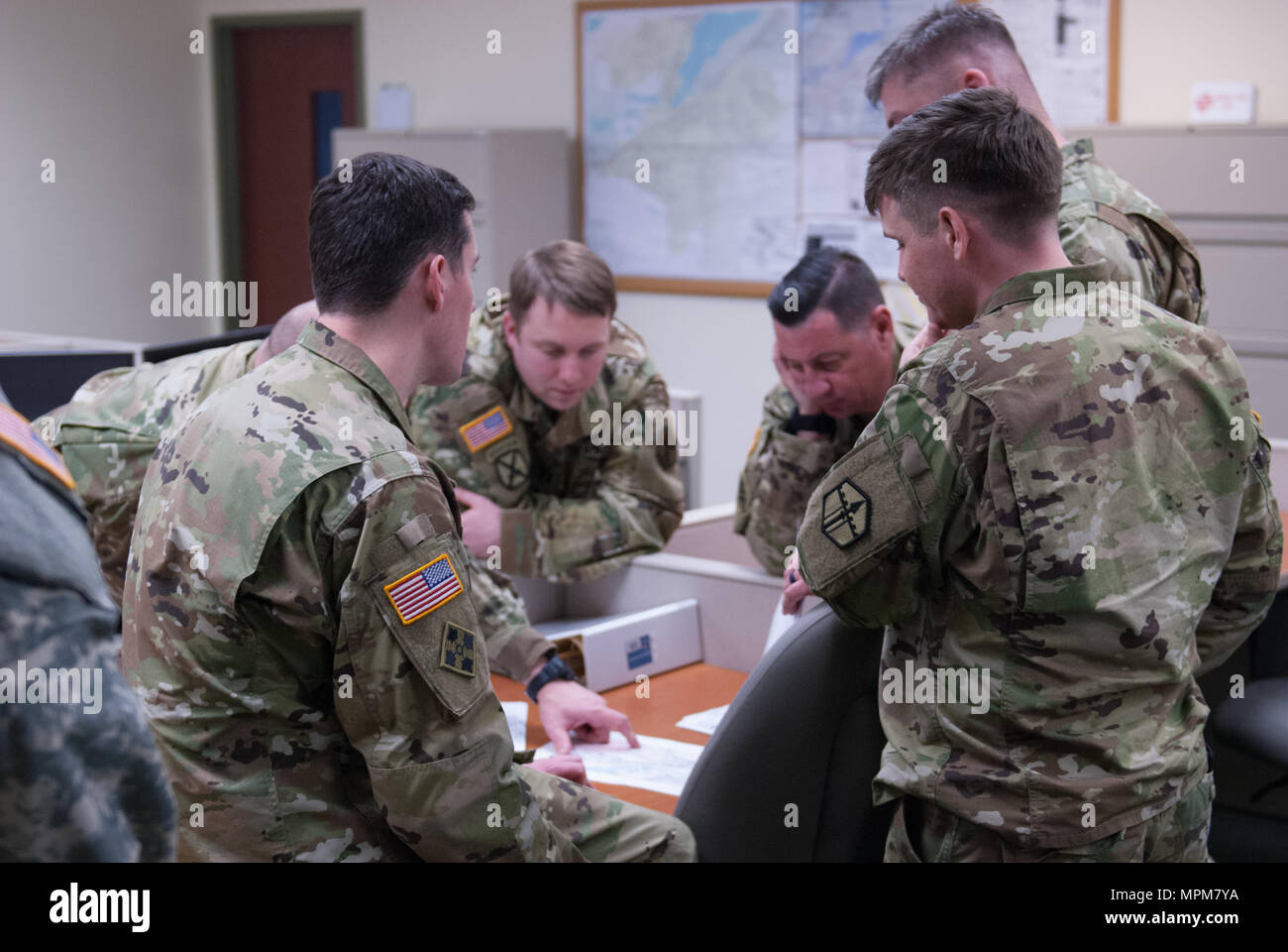 Key leadership from the 301st Maneuver Enhancement Brigade reviews a ...