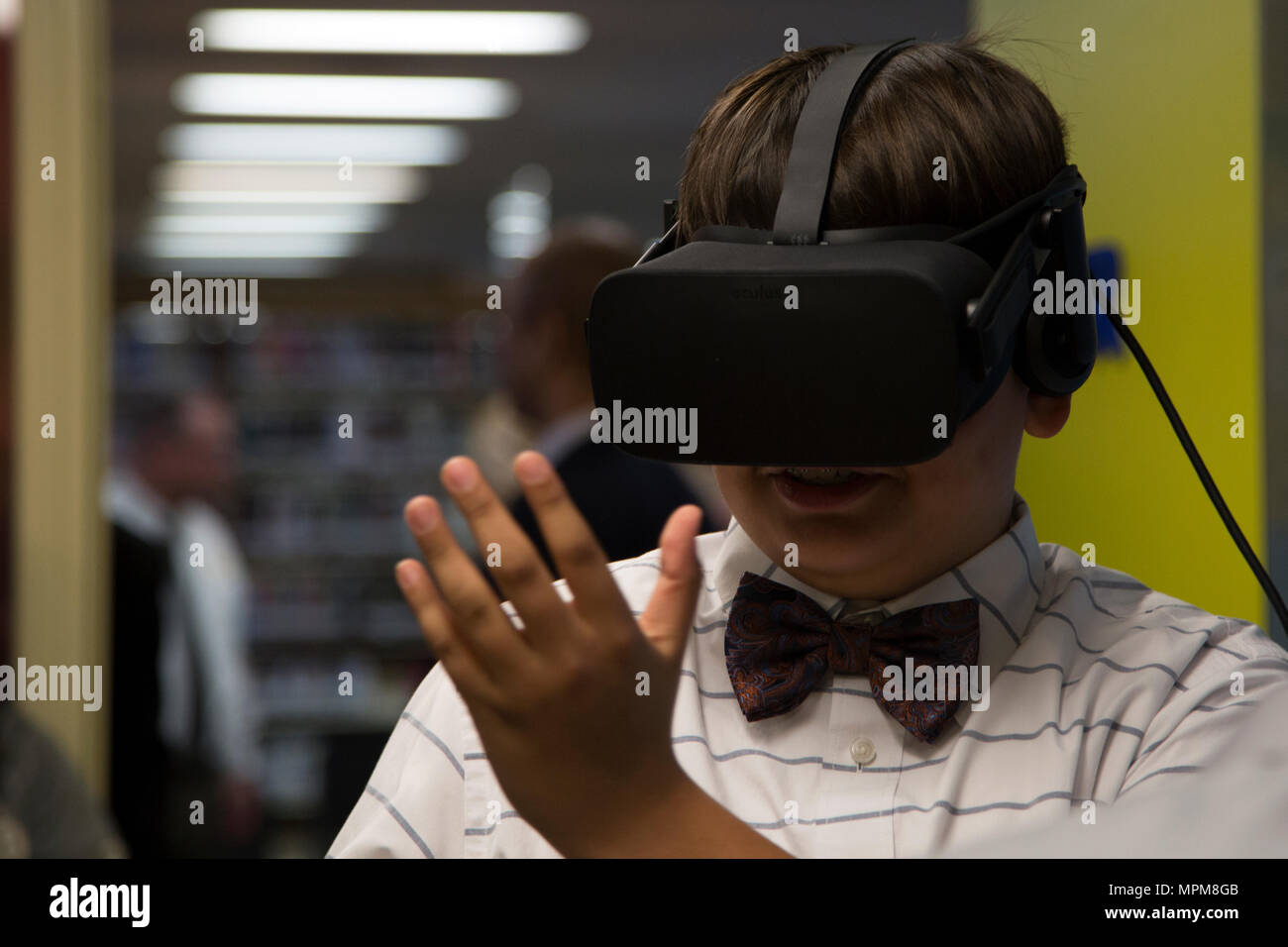 CAMP FOSTER, OKINAWA, Japan— A child interacts with virtual objects ...