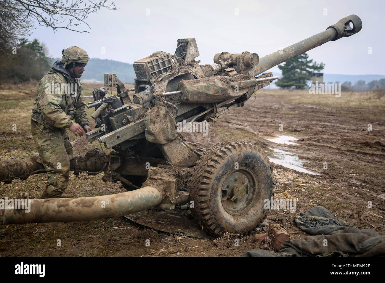 A U.S. Soldier of Alpha Company, 4th Battalion, 319th Airborne Field Artillery Regiment, 173rd ...