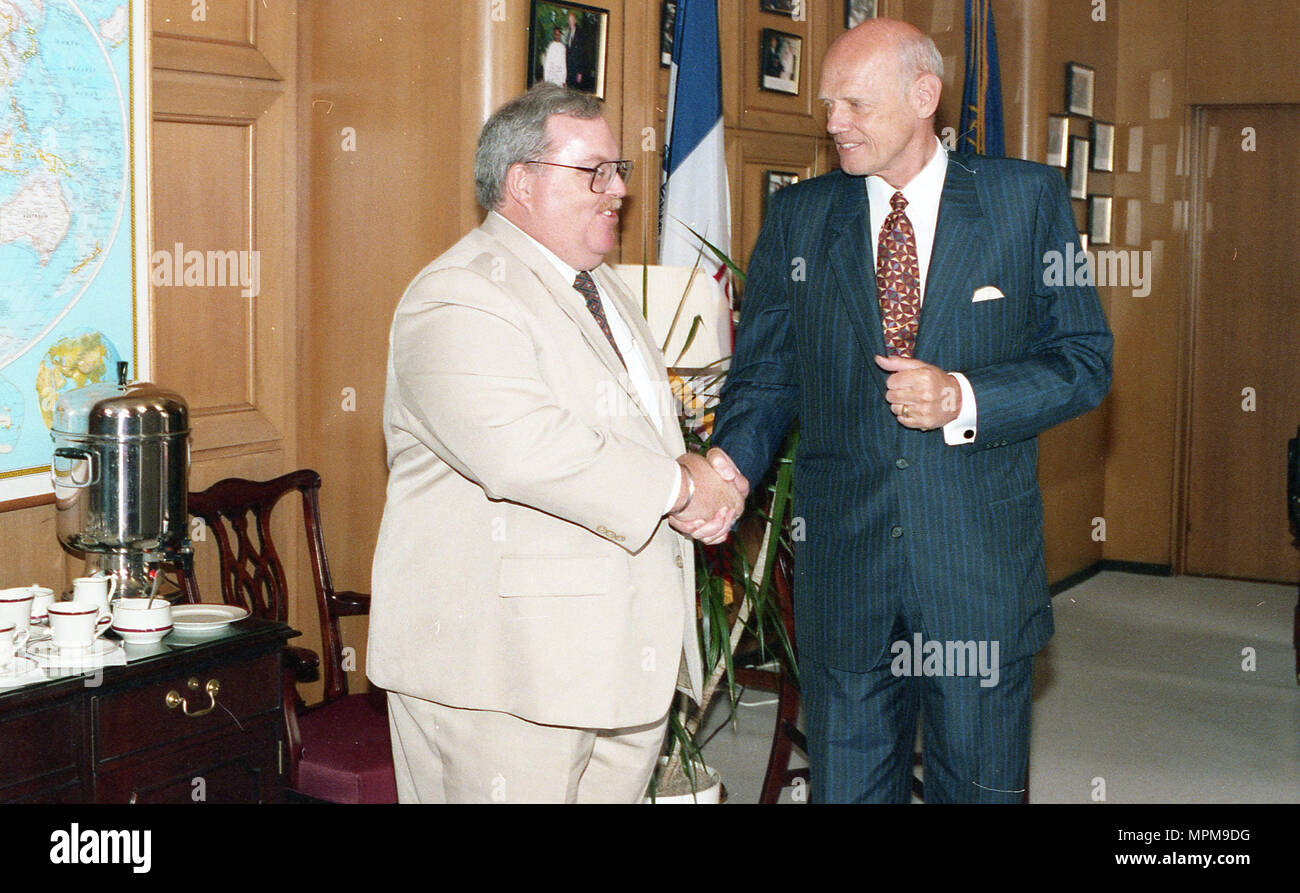 TWO MEN ARE GREETING EACH OTHER IN A OFFICE Stock Photo - Alamy
