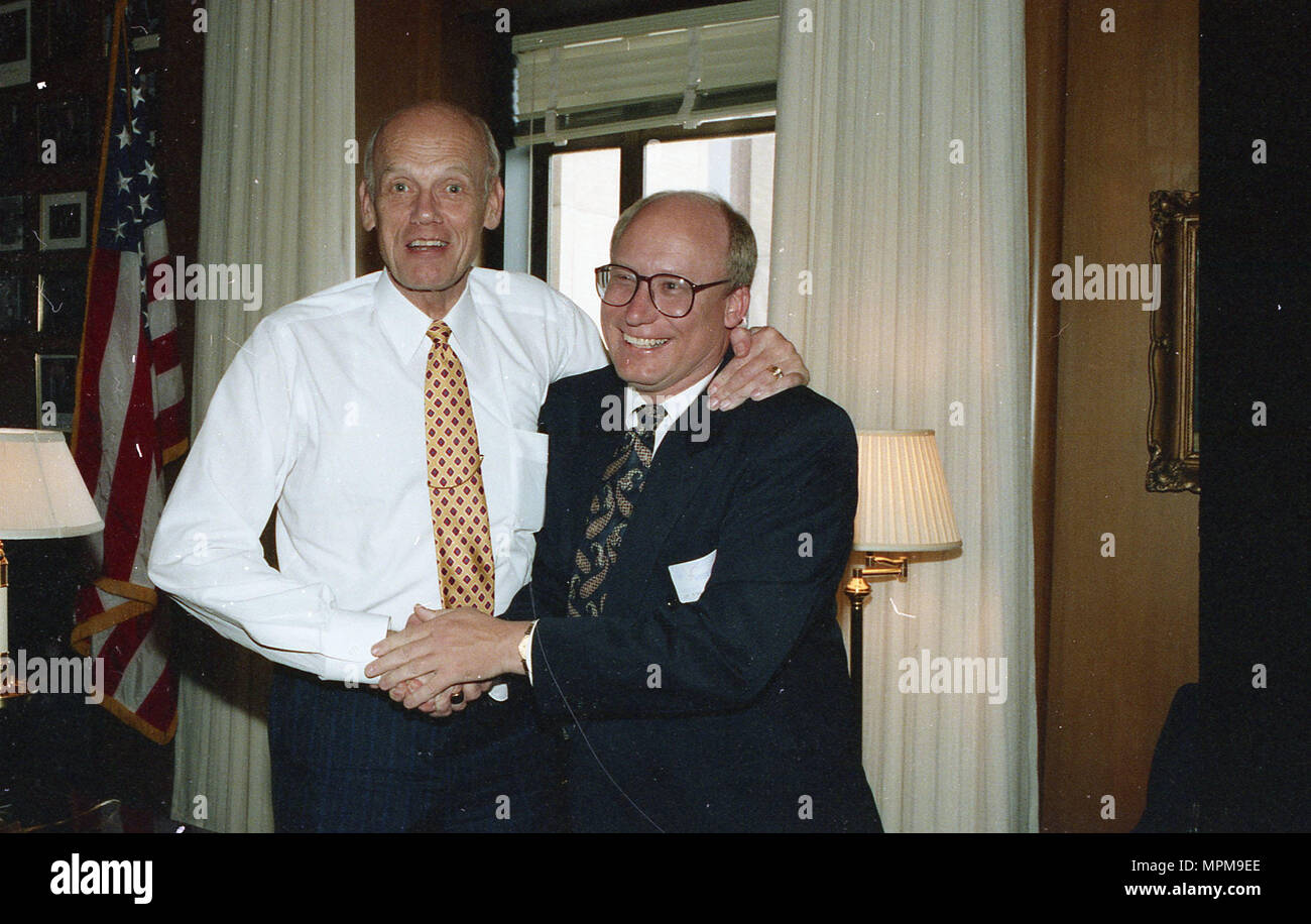 TWO MEN GREETING EACH OTHER WITH A HAND SHACK Stock Photo - Alamy