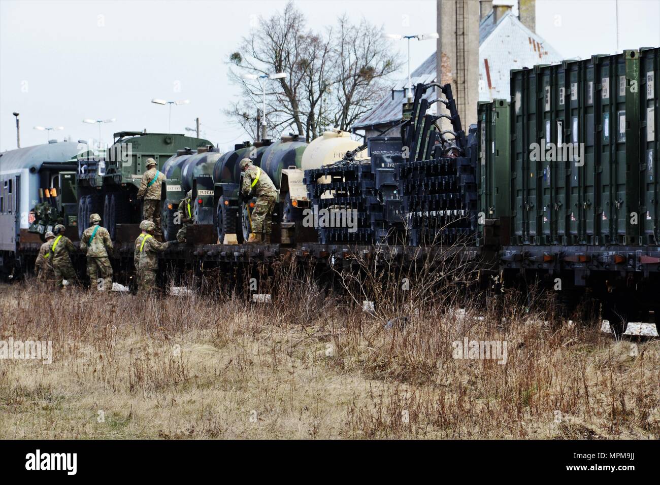 U.S. Soldiers from the 2nd Stryker Cavalry Regiment begin off-loading ...