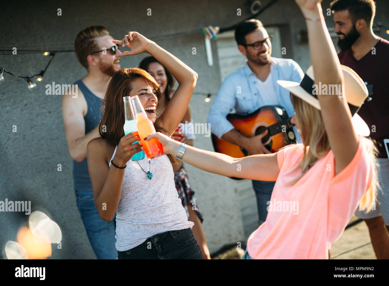 Happy friends laughing and smiling outdoors Stock Photo - Alamy