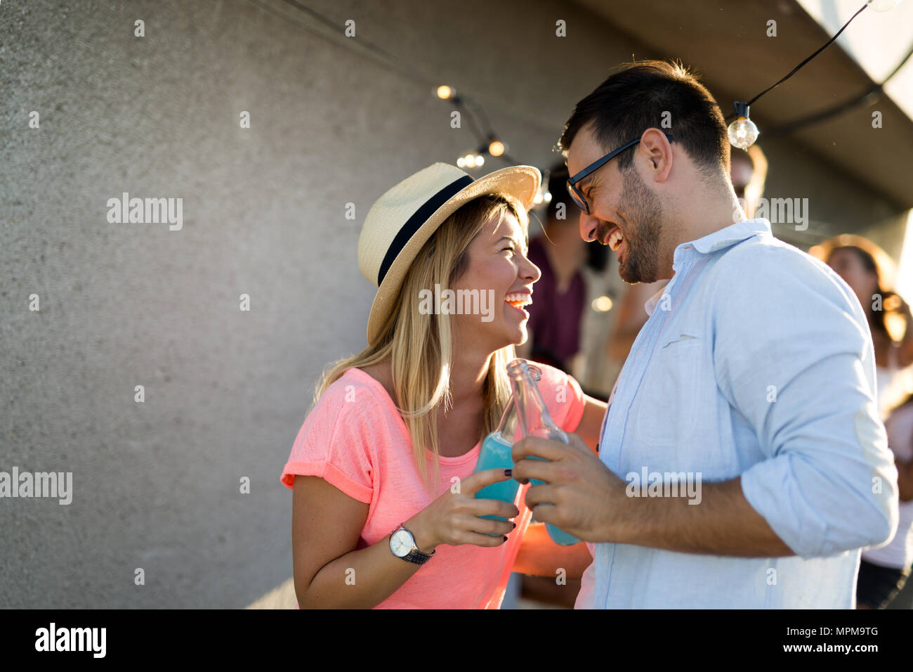 Happy friends laughing and smiling outdoors Stock Photo - Alamy