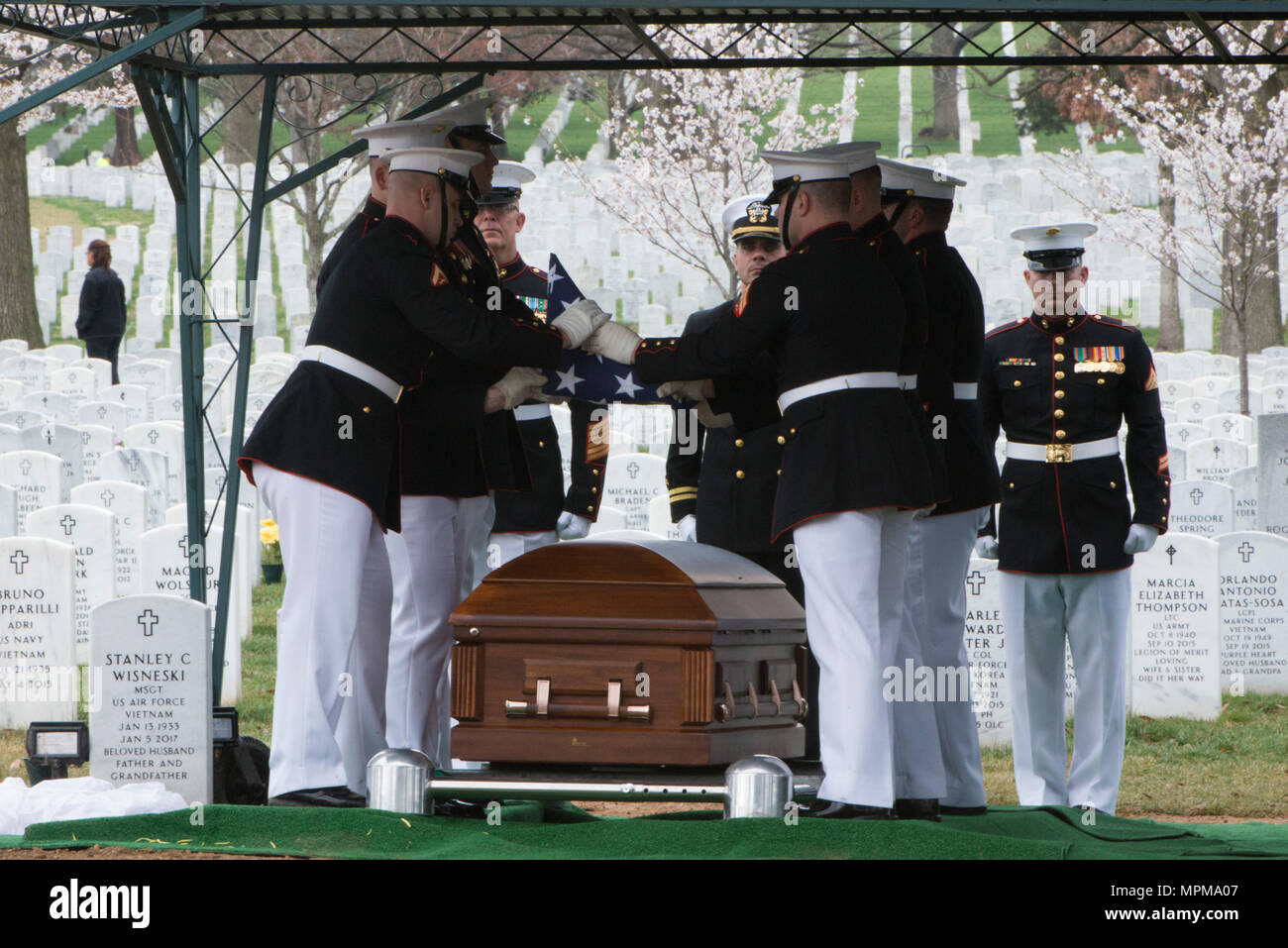 Members of the U.S. Marines take part in the graveside service for ...