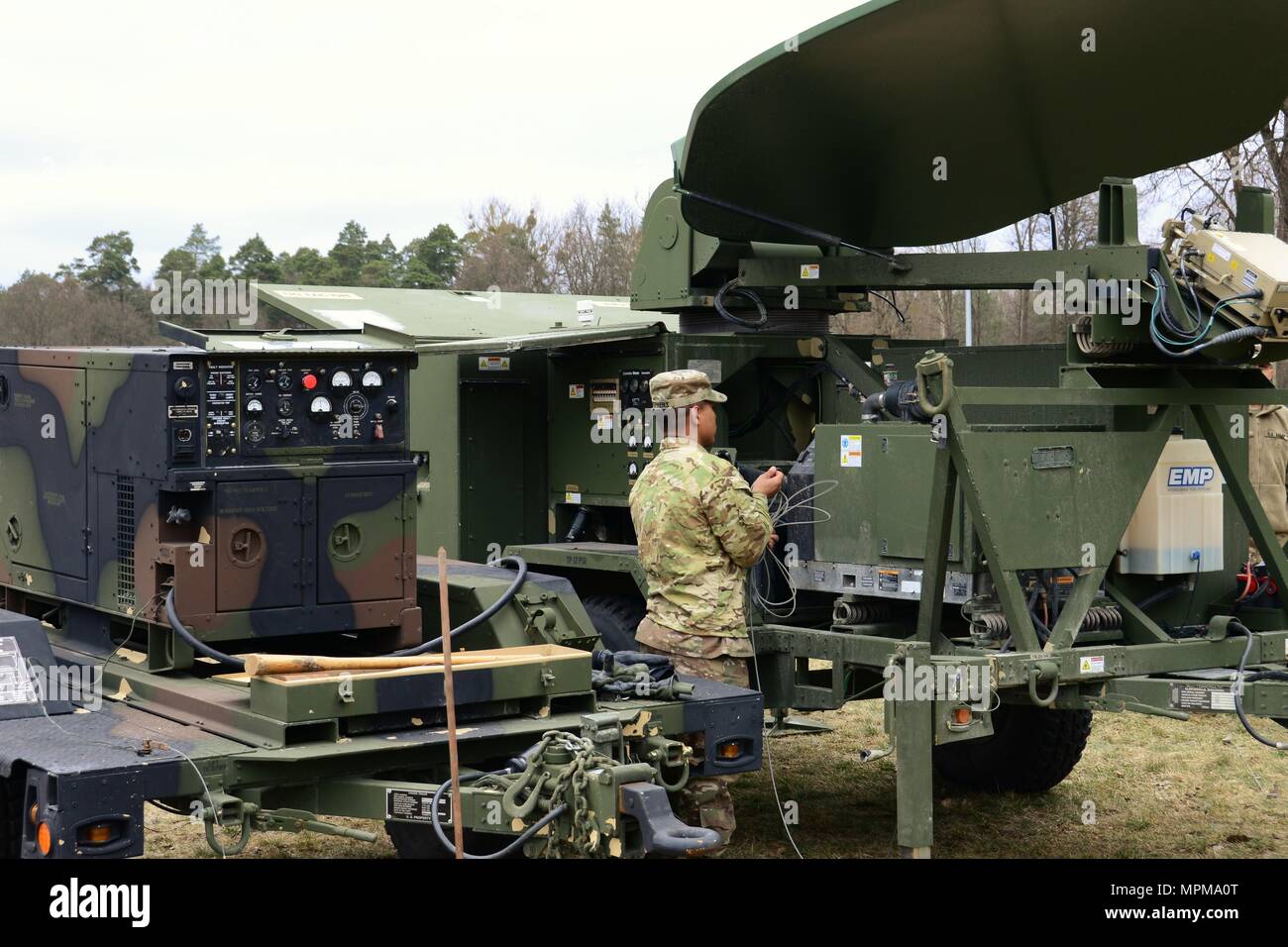 U.S. Soldiers from the 2nd Stryker Cavalry Regiment, set up a Satellite ...