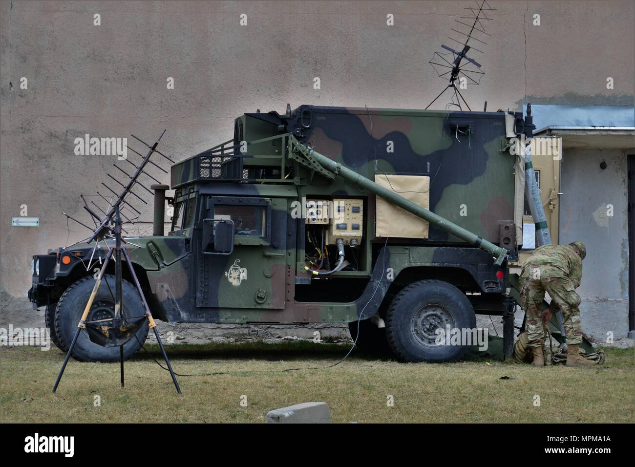 U.S. Soldiers from the 2nd Stryker Cavalry Regiment, set up a Satellite ...