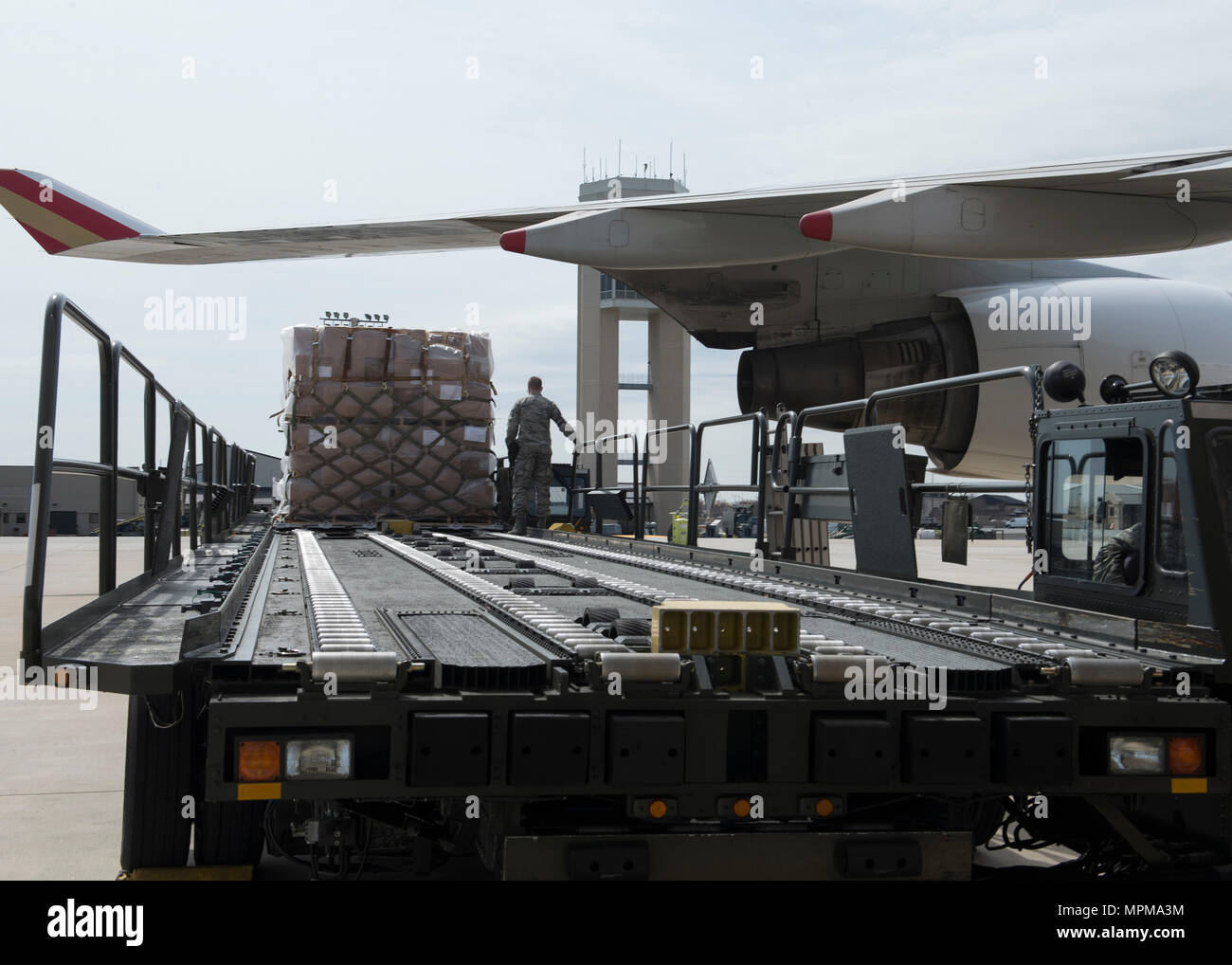Airmen from the 436th Aerial Port Squadron load cargo onto a Kalitta ...
