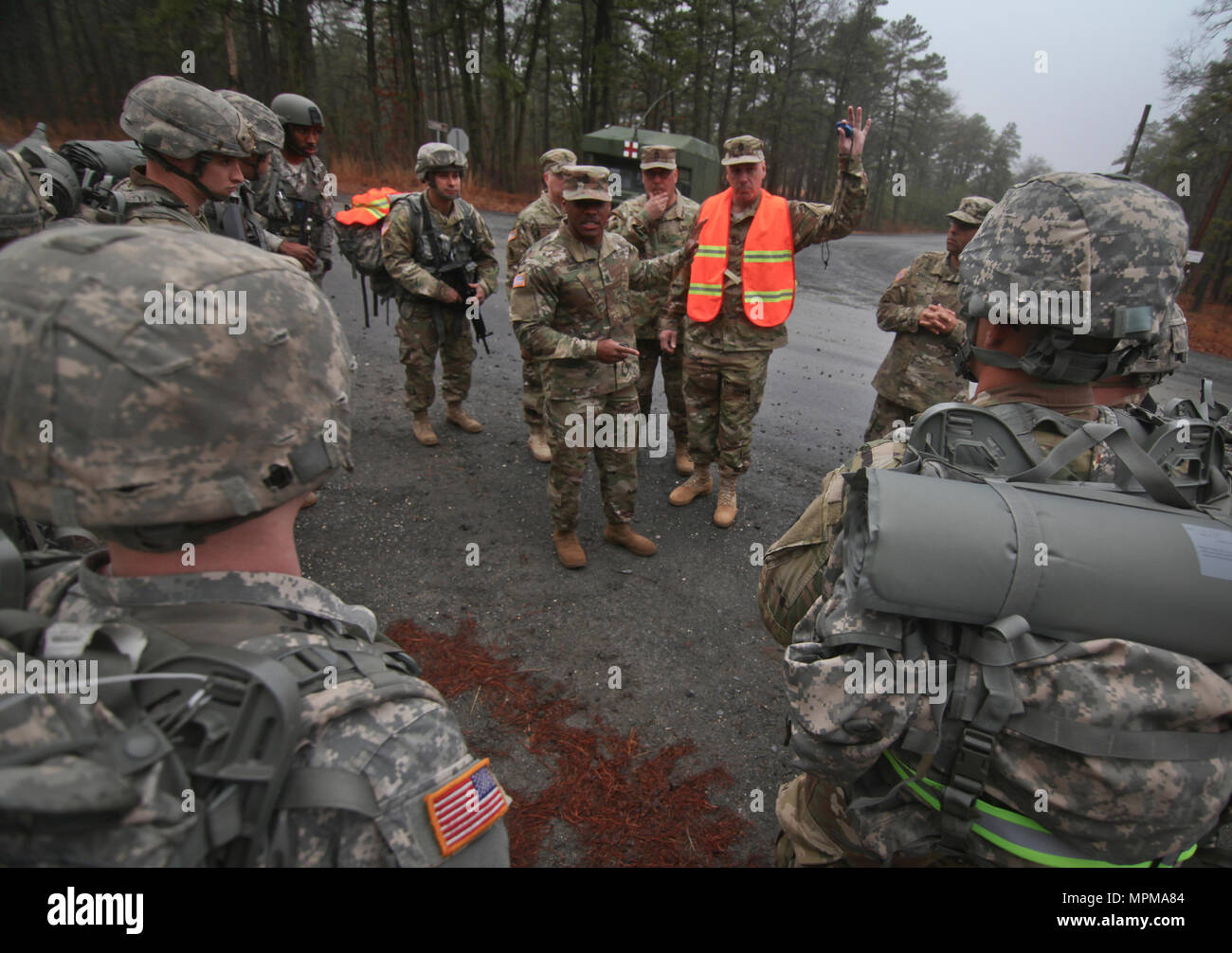U.S. Army Soldiers from the New Jersey Army National Guard listen to a ...