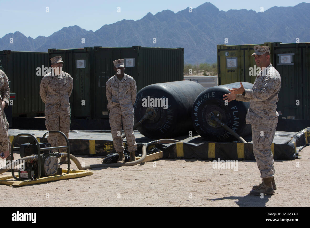 U.S. Marine Corps Staff Sgt. Jason Pimental, forward arming refueling ...