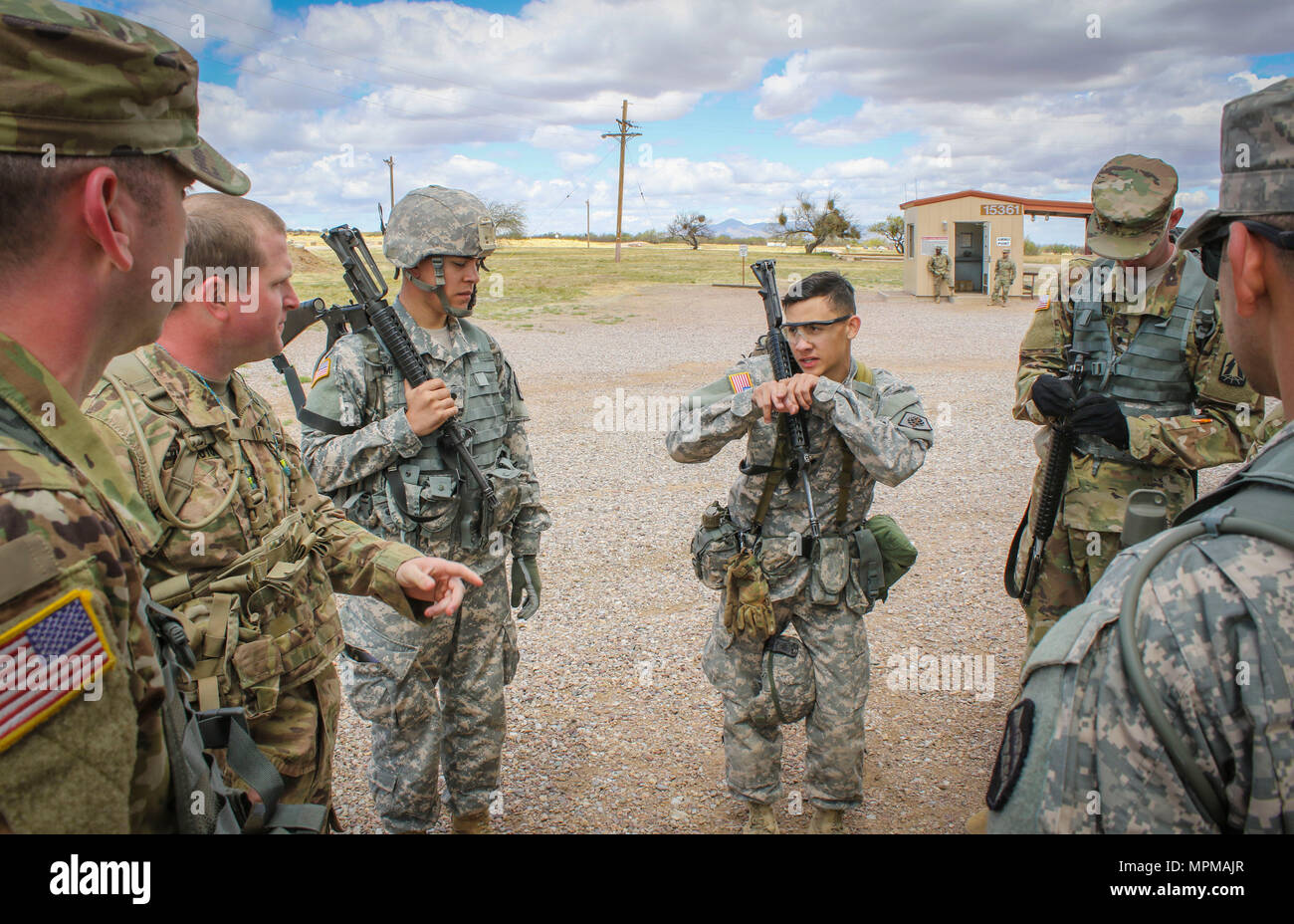 Army Reserve Spc. Julian Ditona (center), a multi-channel transmission ...