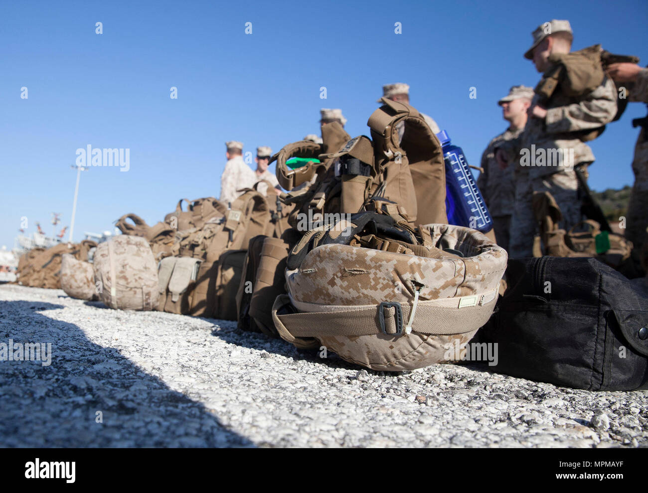 Marines with the 24th Marine Expeditionary Unit stage their gear on a ...