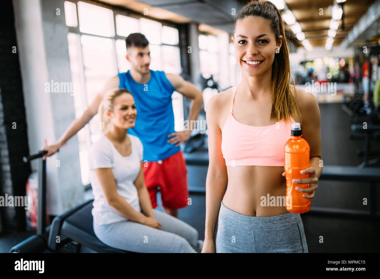 Group of healthy fitness people in gym Stock Photo - Alamy