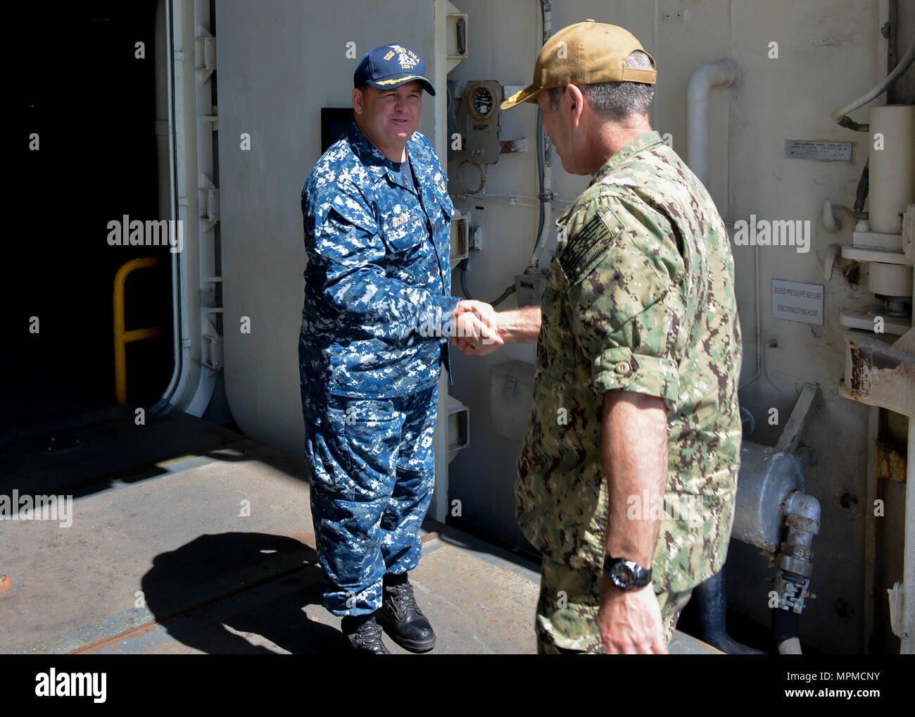 MAYPORT, Fla. (March 28, 2017) – Capt. James Midkiff, left, commanding ...
