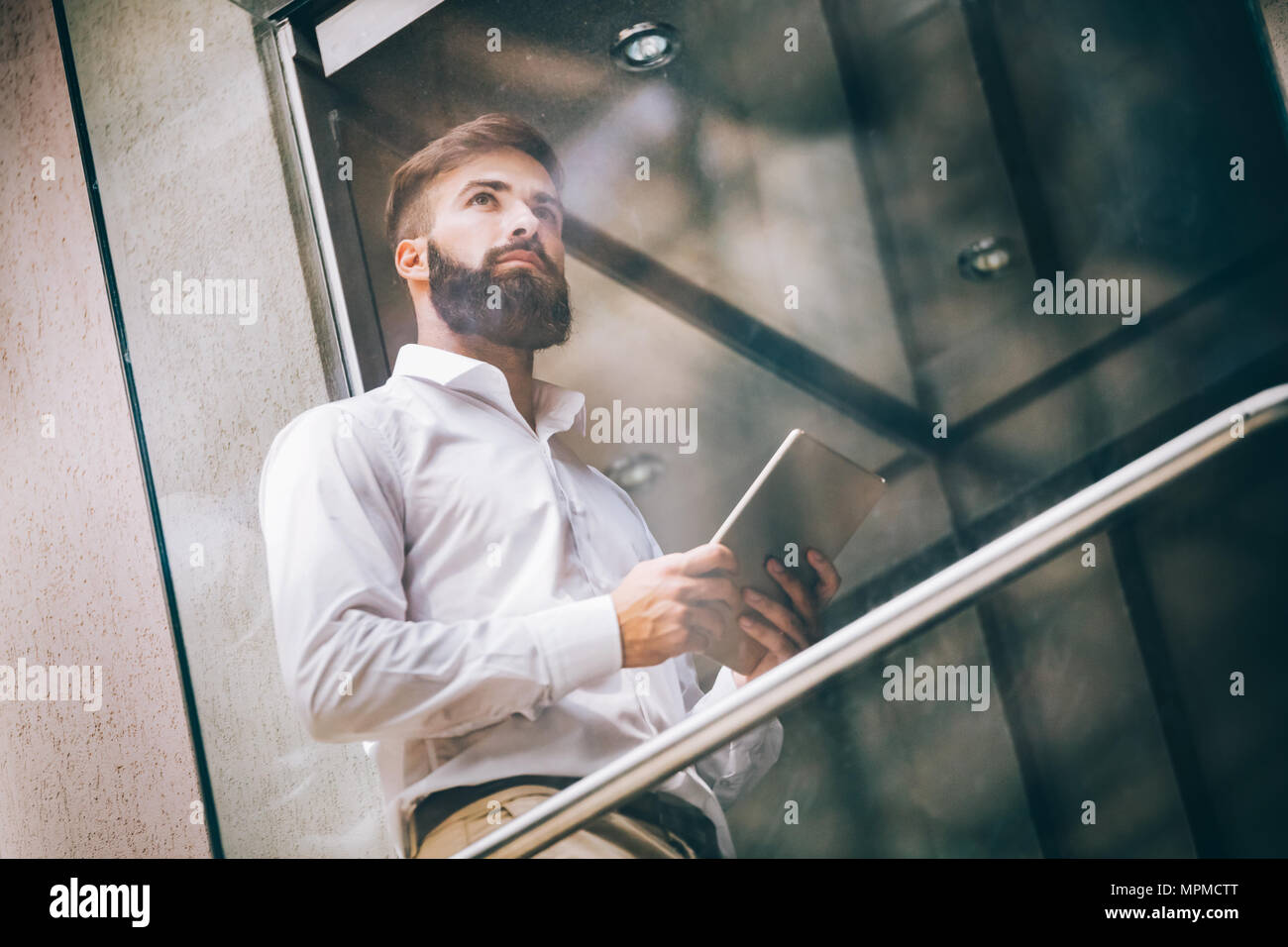 Elevator people inside hi-res stock photography and images - Alamy