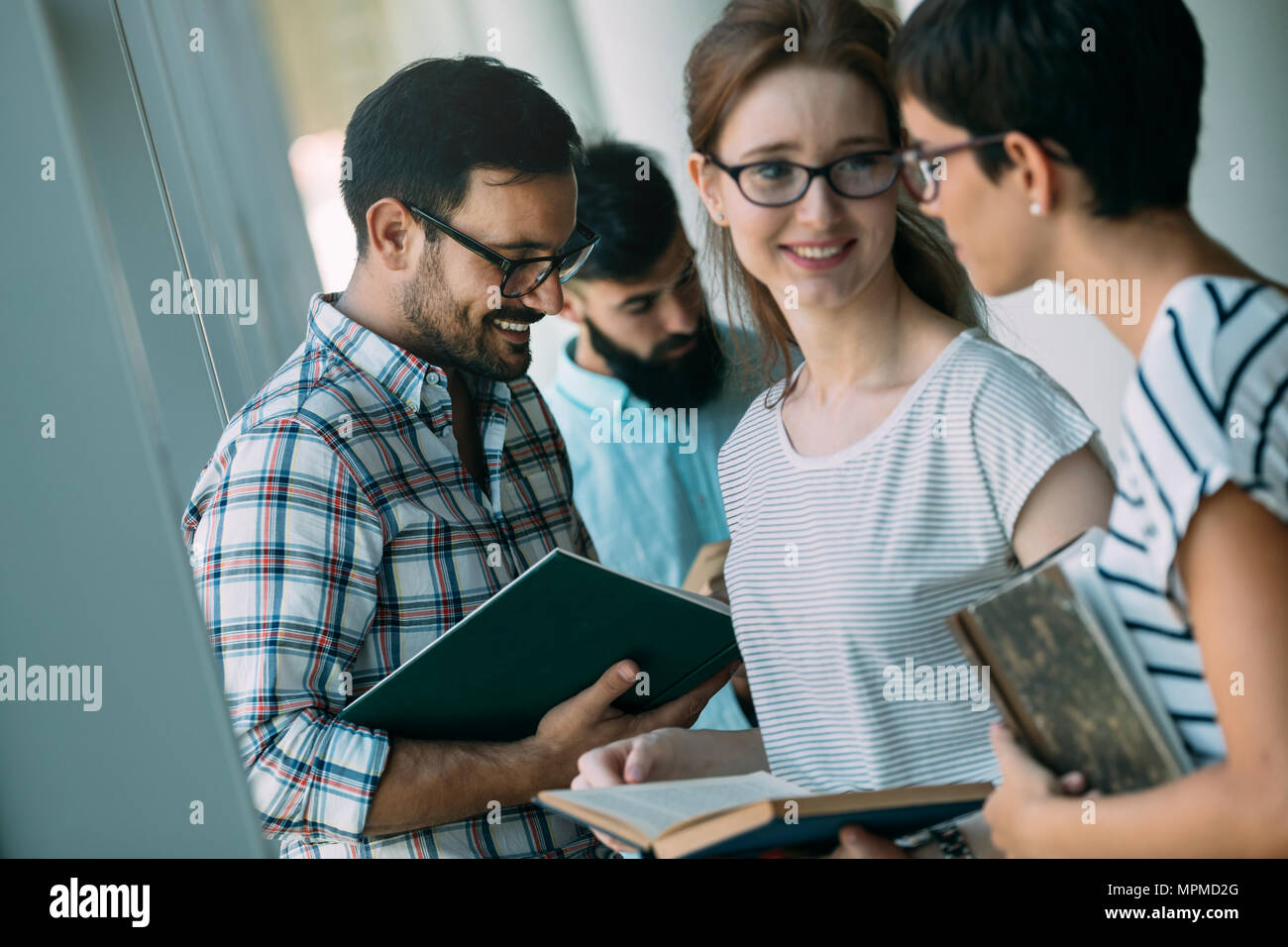 Group of Young Students Studying together at Library Stock Photo - Alamy