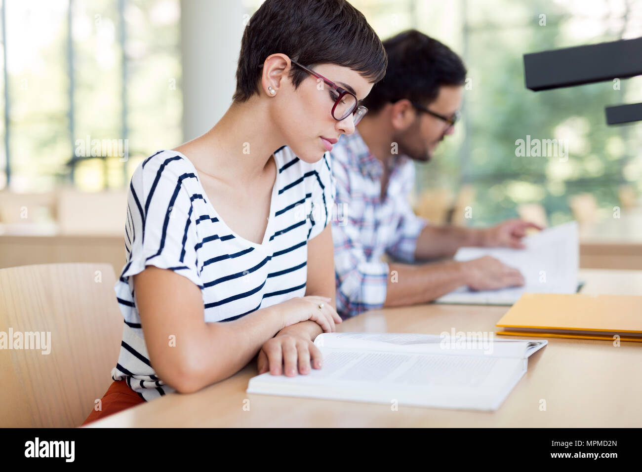 Couple of happy students at the university Stock Photo - Alamy
